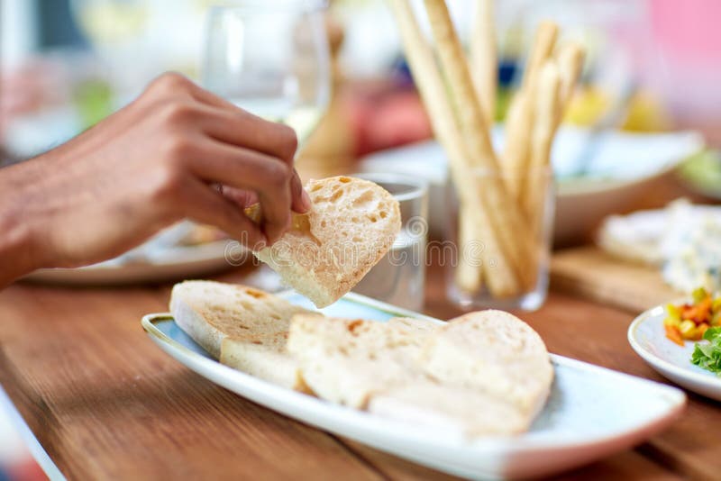 Hand Taking Piece of Bread from Plate Stock Photo - Image of fresh ...