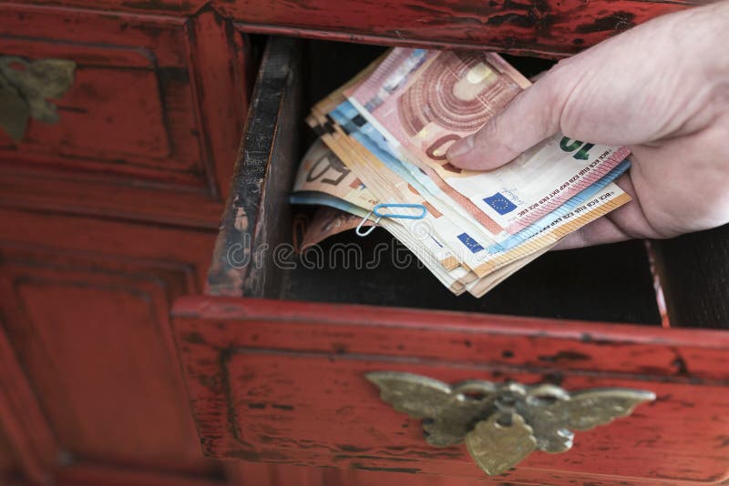 Hand Taking Stack of Paper Money from Drawer Stock Image - Image of ...