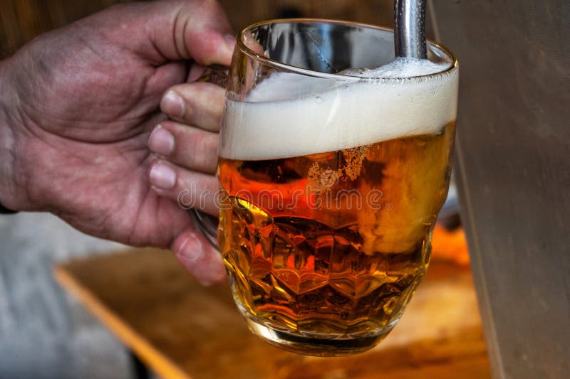 Hand tapping beer, closeup stock image. Image of brew - 284884493