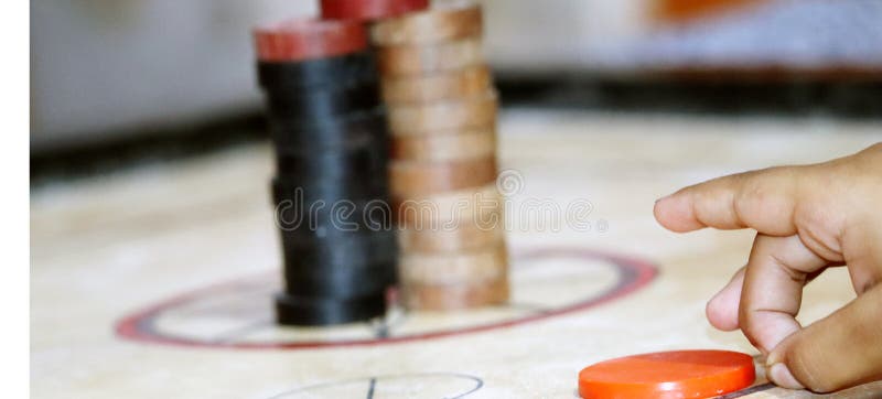 A Hand Target and Focus on Wooden Round Carrom Pawn Stock Image - Image ...