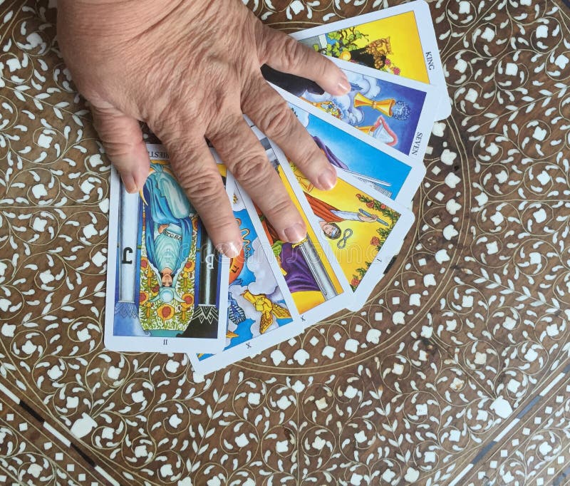 Hand on Tarot Cards stock photo. Image of readings, hands - 60275264