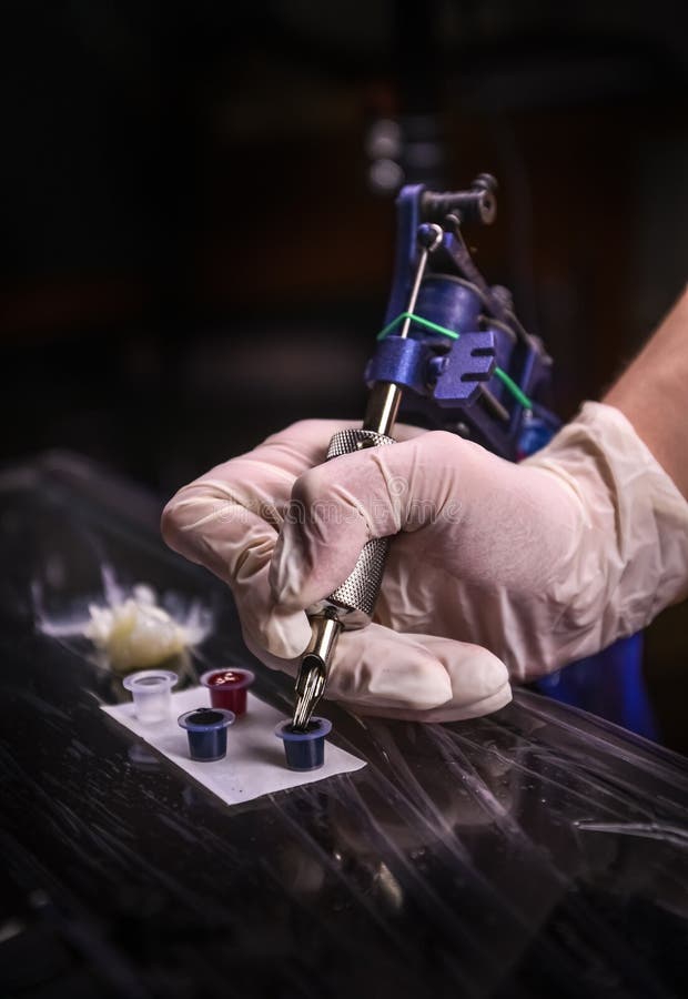 Hand of the tattoo artist. stock image. Image of studio - 247167257