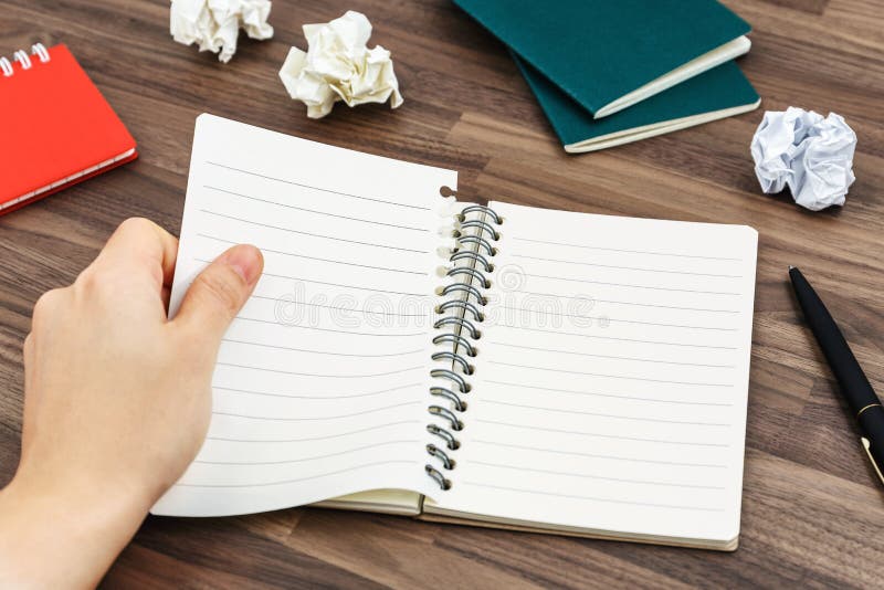 Hand Tearing Paper from Notebook Stock Image - Image of wood, writing ...