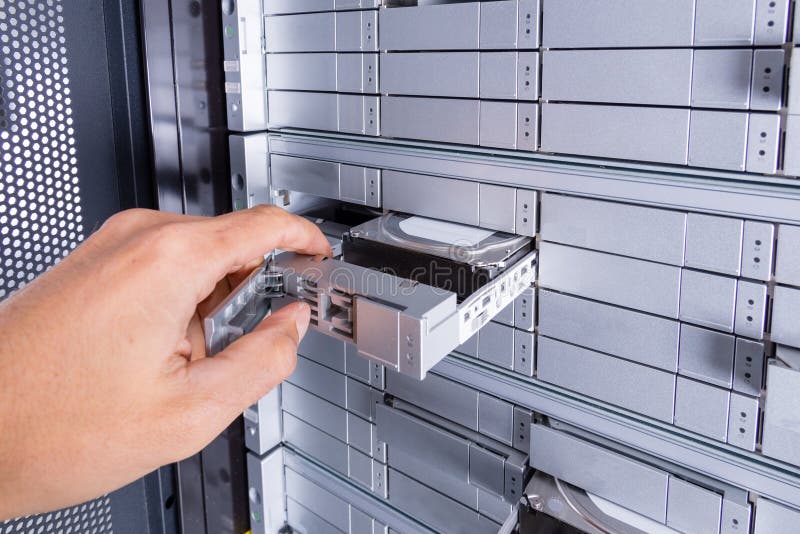 Hand of a Technician Exchanging Hard Drive with SAS Interface in Stock ...