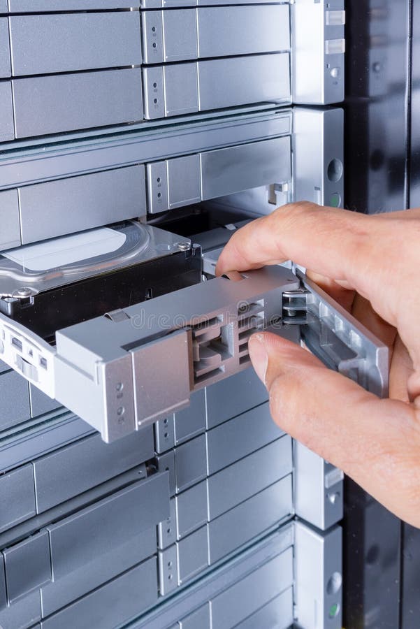 Hand of a Technician Exchanging Hard Drive with SAS Interface in Stock ...