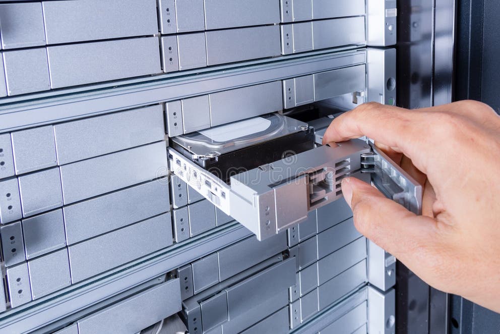 Hand of a Technician Exchanging Hard Drive with SAS Interface in Stock ...