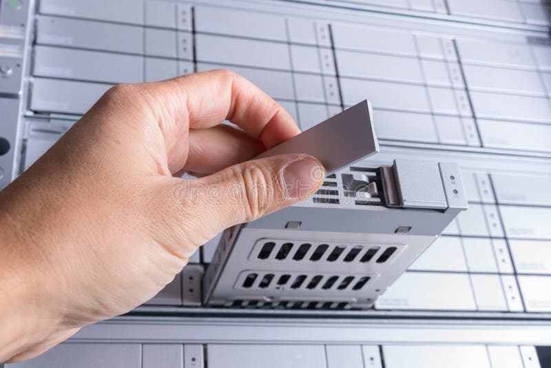 Hand of a Technician Exchanging Hard Drive with SAS Interface in Stock ...