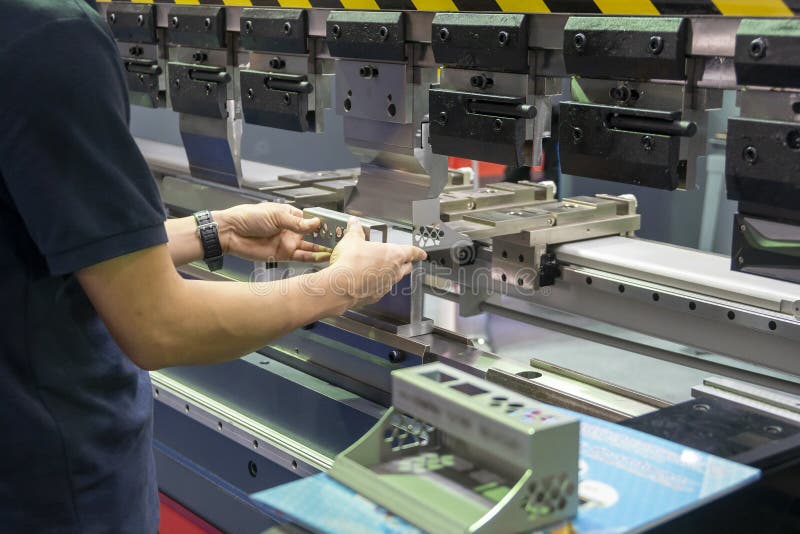 The Hand of Technician Operator Working with Hydraulic Press Brake ...
