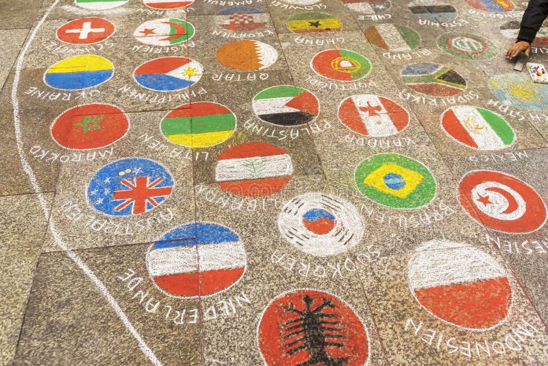 Hand of Teenager Drawing Multi-colored Flags of Different Countries in ...