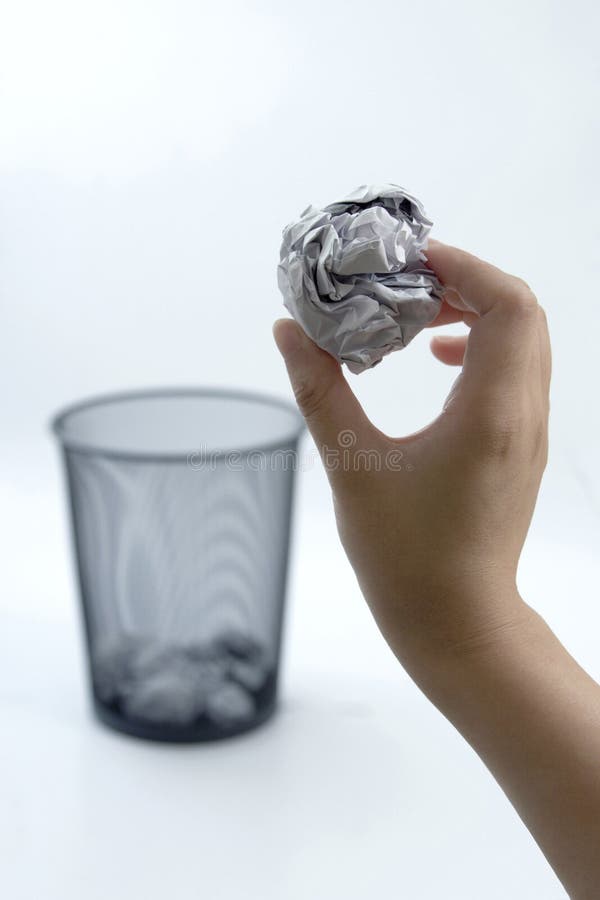 Hand Throwing Crumpled Paper into Dustbin. Conceptual Image Stock Photo ...