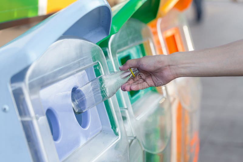 Hand Throwing Empty Glass Bottle into the Trash Stock Image - Image of ...