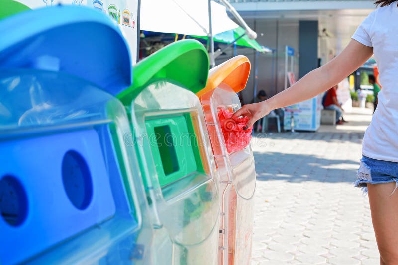 Hand Throwing Empty Plastic Bag into the Trash. Stock Image - Image of ...