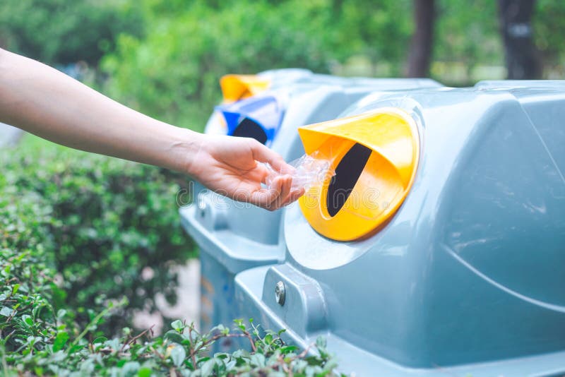 Hand Throwing a Plastic Bag into the Bin. Stock Photo - Image of ...