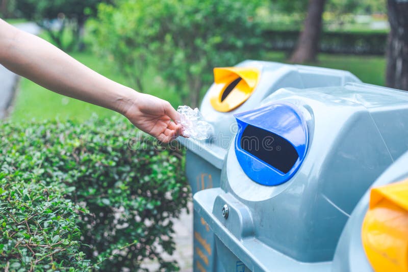 Hand Throwing a Plastic Bag into the Bin. Concepts of Environment Stock ...