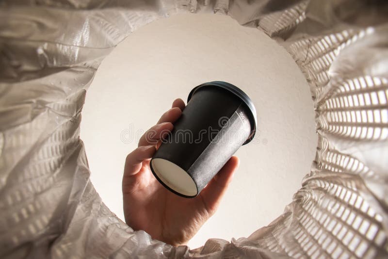 A Hand Throws a Paper Cup into the Trash Can. Inside View Stock Image ...
