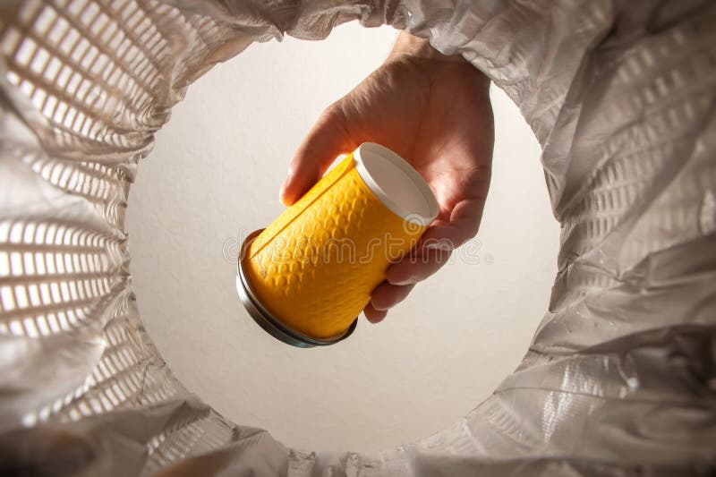 A Hand Throws a Paper Cup into the Trash Can. Inside View Stock Image ...