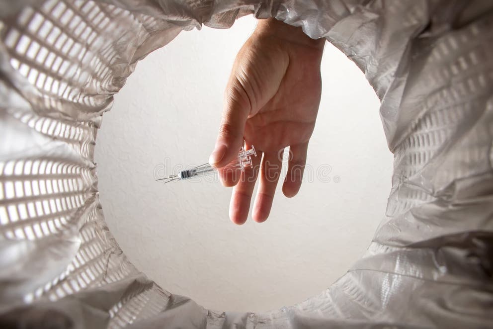 Hand Throws Syringe into Trash Bin with Package. Inside View Stock ...