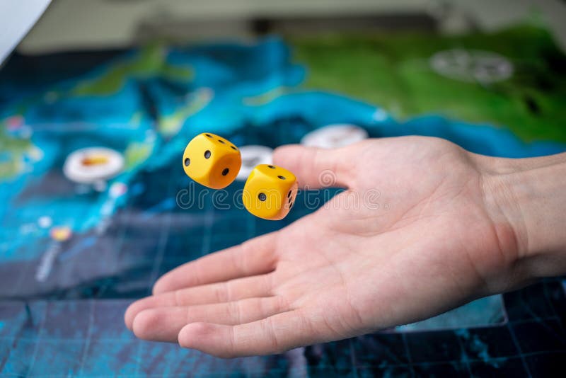 The Hand Throws Yellow Dice on the Playing Field. Luck and Excitement ...