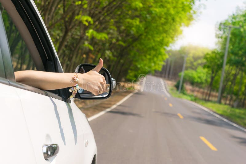 Hand Thumbs Car on the Road Stock Image - Image of drive, license: 88010397