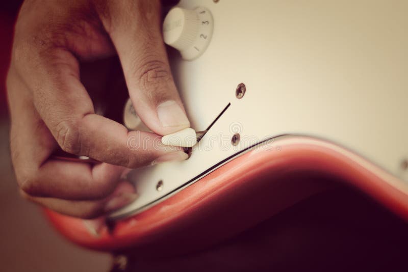 Hand on tone control stock photo. Image of knob, bass - 79412610