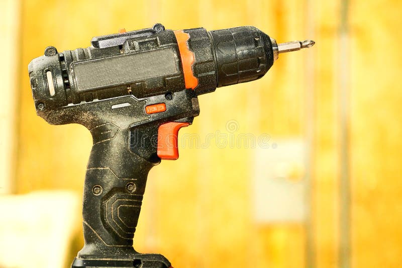 Electric Drill,screwdriver on a Plywood Wooden Surface with Sawdust in ...