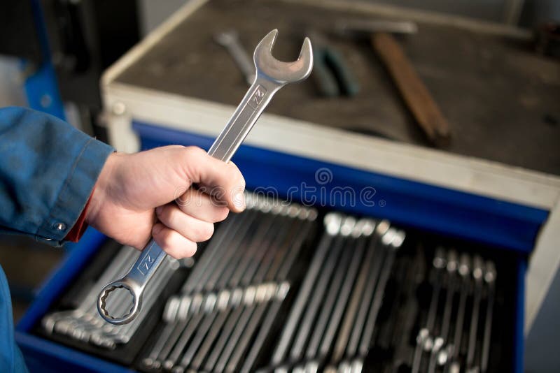 Hand with Tools in Front of an Engine Bay Stock Photo - Image of pincer ...