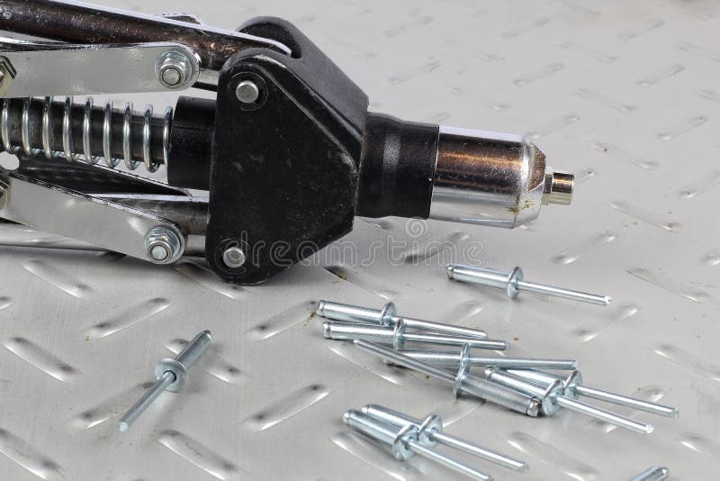 Hand Tools. Riveter for Mounting Blind Rivets on a Steel Background ...