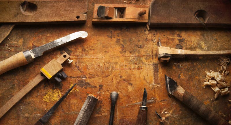 Hand Tools Wood Drill Jig Saw Plane Chisel on an Old Wooden Workbench ...