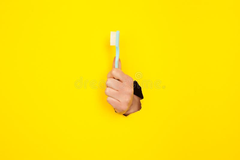 Hand with toothbrush stock photo. Image of care, freshness - 93320864