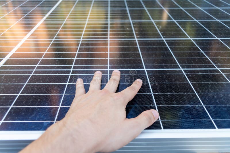 Hand on Top of a Solar Panel Stock Photo - Image of power, environment ...