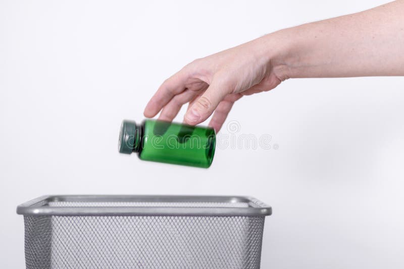 Hand Tosses a Plastic Small Bottle in the Trash Stock Image - Image of ...