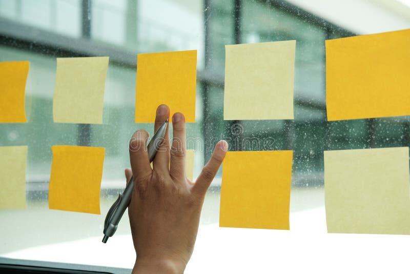 Hand Touch on Adhesive Notes on Glass Wall. Sticky Note Paper Re Stock ...