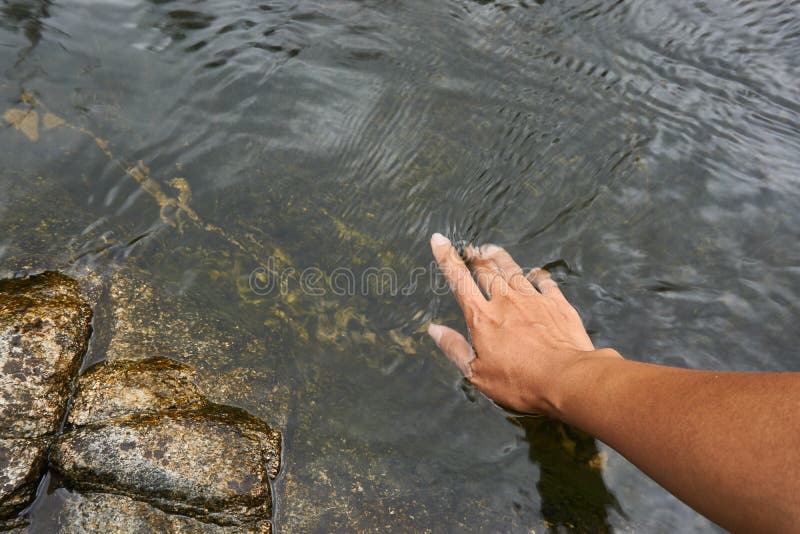 A Hand Touch Natural Water Surface Stock Image - Image of human, drop ...