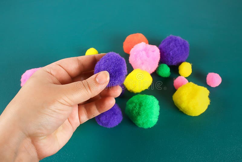 Hand Touches Soft Woolen Pompom. the Concept of Touch, Tactility ...