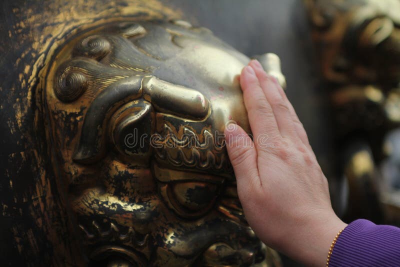 Hand Touching Bronze Lion Head Stock Image - Image of decorative ...