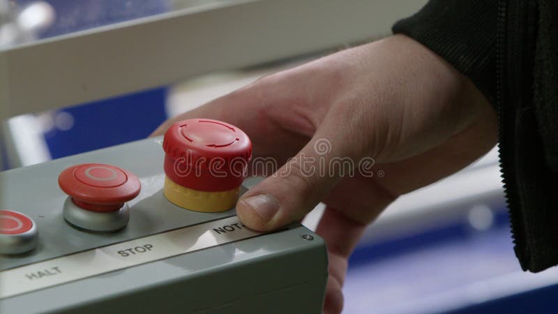 Hand Touching the Control Panel Close To the Emergency Stop Push Button ...