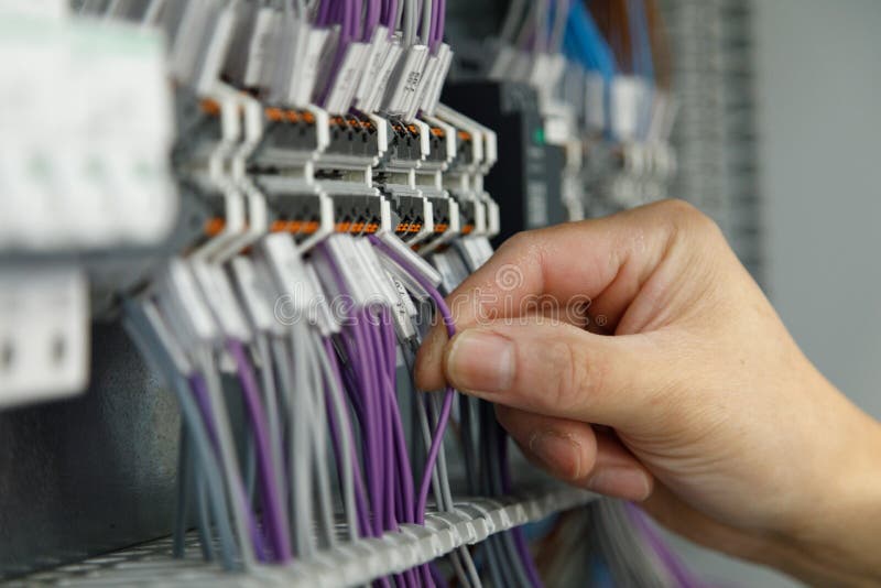 Hand Touching the Electrical Wires in Electrical Terminal Blocks Stock ...
