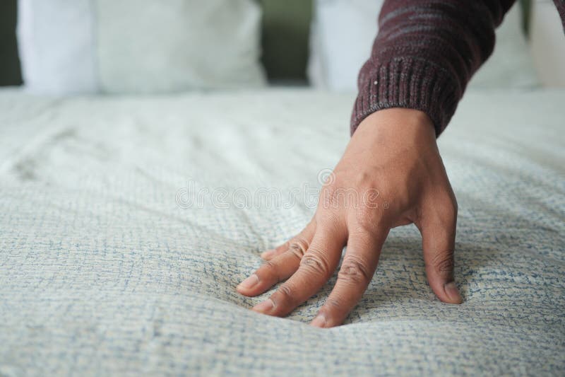 Hand Touching and Pressing Orthopedic Mattress on Bed. Stock Image ...