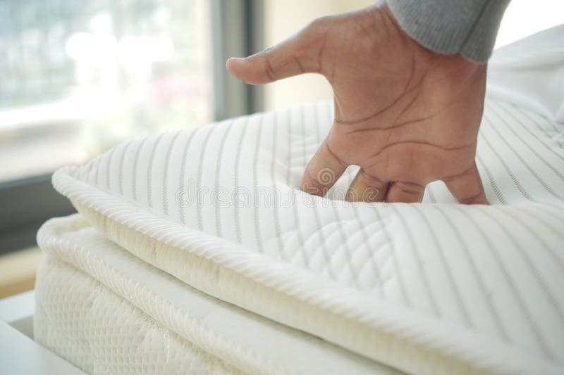Hand Touching and Pressing Orthopedic Mattress on Bed. Stock Image ...