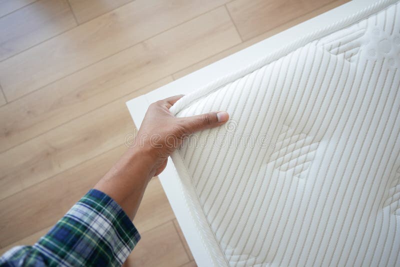 Hand Touching and Pressing Orthopedic Mattress on Bed. Stock Photo ...