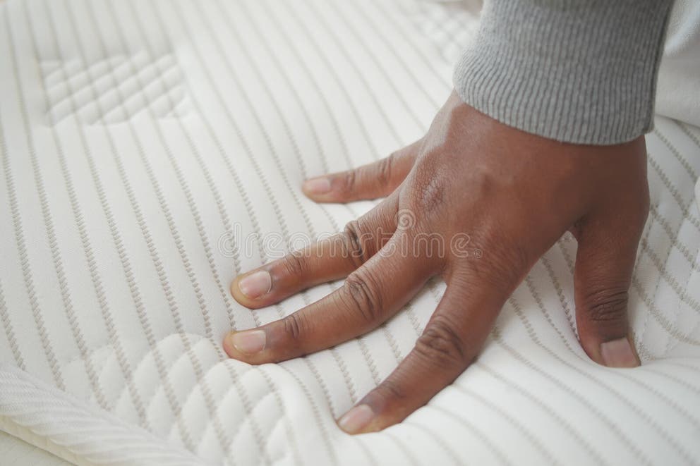 Hand Touching and Pressing Orthopedic Mattress on Bed. Stock Photo ...