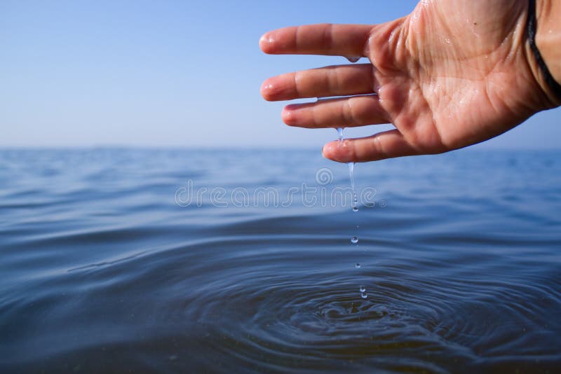 Hand touching the water stock photo. Image of relaxation - 263931458