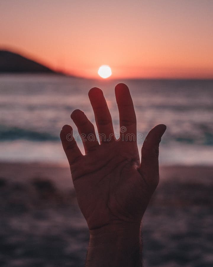 Hand Towards the Sun in the Sunset Stock Image - Image of darkness ...