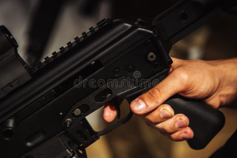 Hand on the Trigger of a Machine Gun. Close-up Stock Image - Image of ...