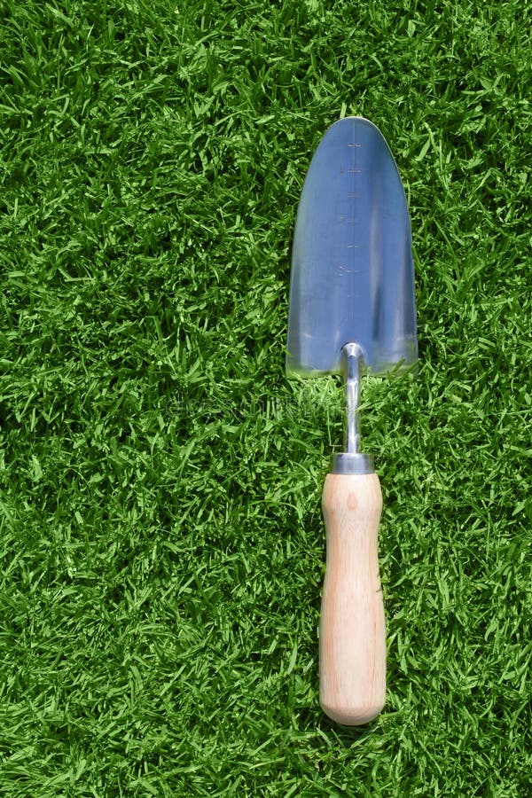 Hand trowel on the lawn stock image. Image of lawn, conceptual - 25198247