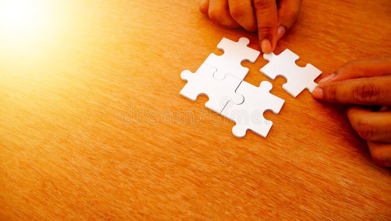 Hand Try To Put White Puzzle Jigsaw and Lay the Jigsaw on Missing Area ...