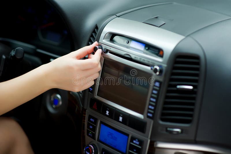 Hand Tunes in Radio Stations and Adjusting Sound Volume on the Car ...
