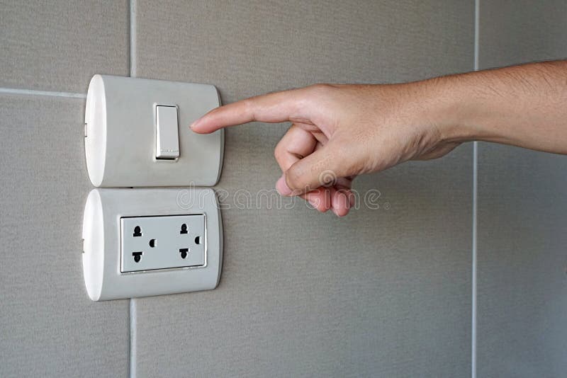 Hand Turn on a Power, Finger Pushing Light Switch Button with Plug on ...