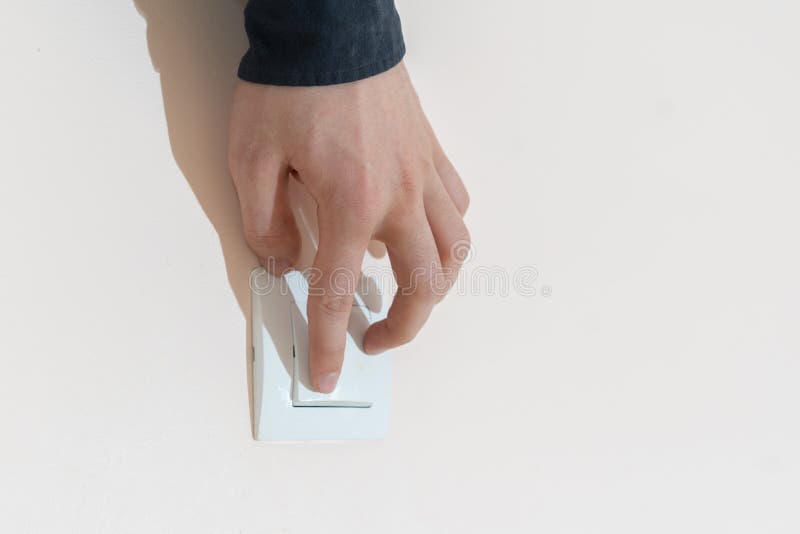 A Hand Turn on the Power Switch on, Turn on the Lights at Home Stock ...
