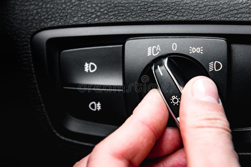 Hand Turning Auto Light in Luxury Car. Stock Image - Image of metal ...